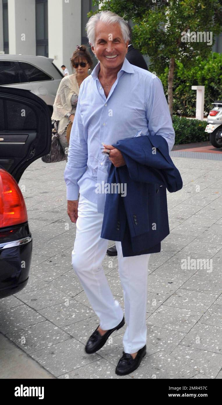 Actor George Hamilton is all smiles as he leaves his luxury hotel while ...