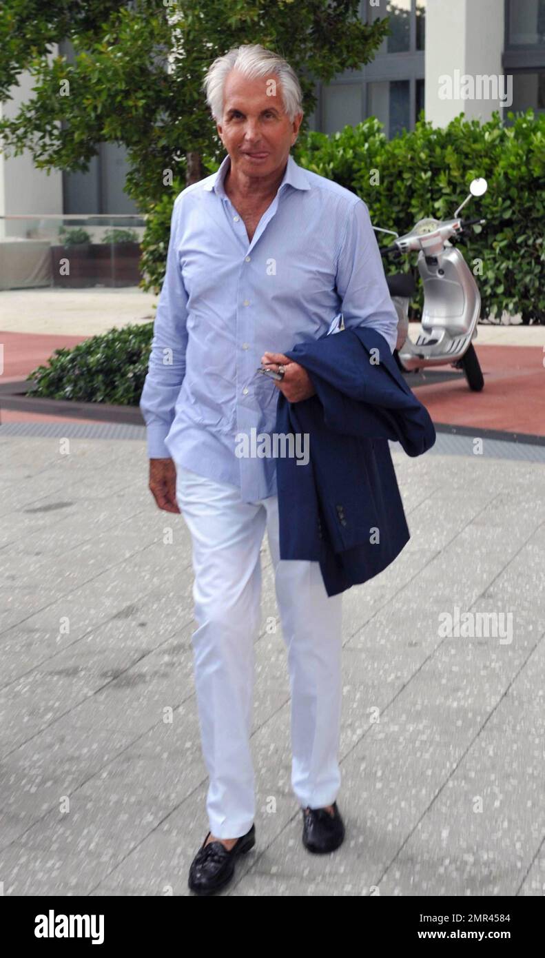 Actor George Hamilton is all smiles as he leaves his luxury hotel while ...