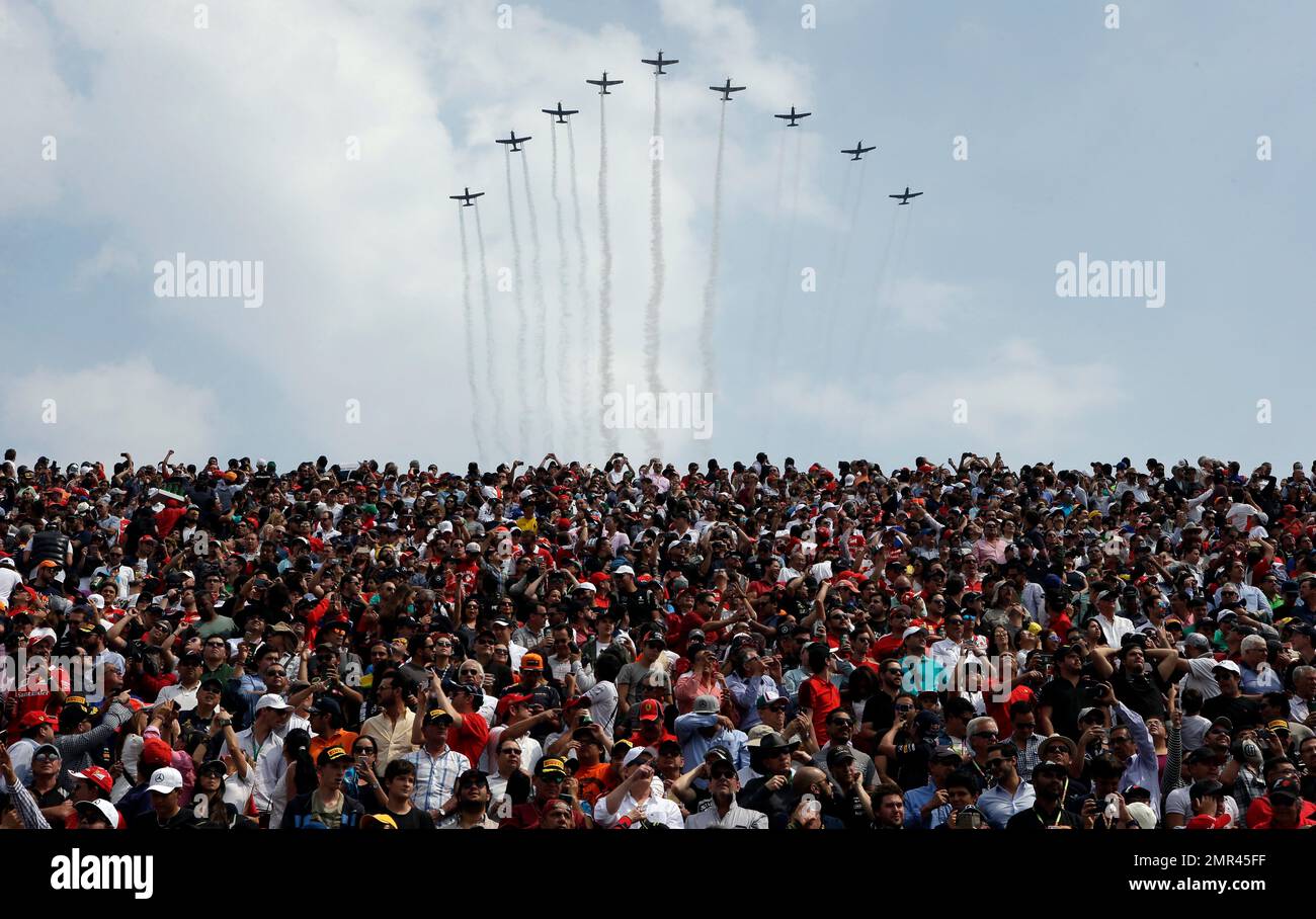 Spectators cheer as Mexican air force jets fly over Hermanos Rodriguez ...