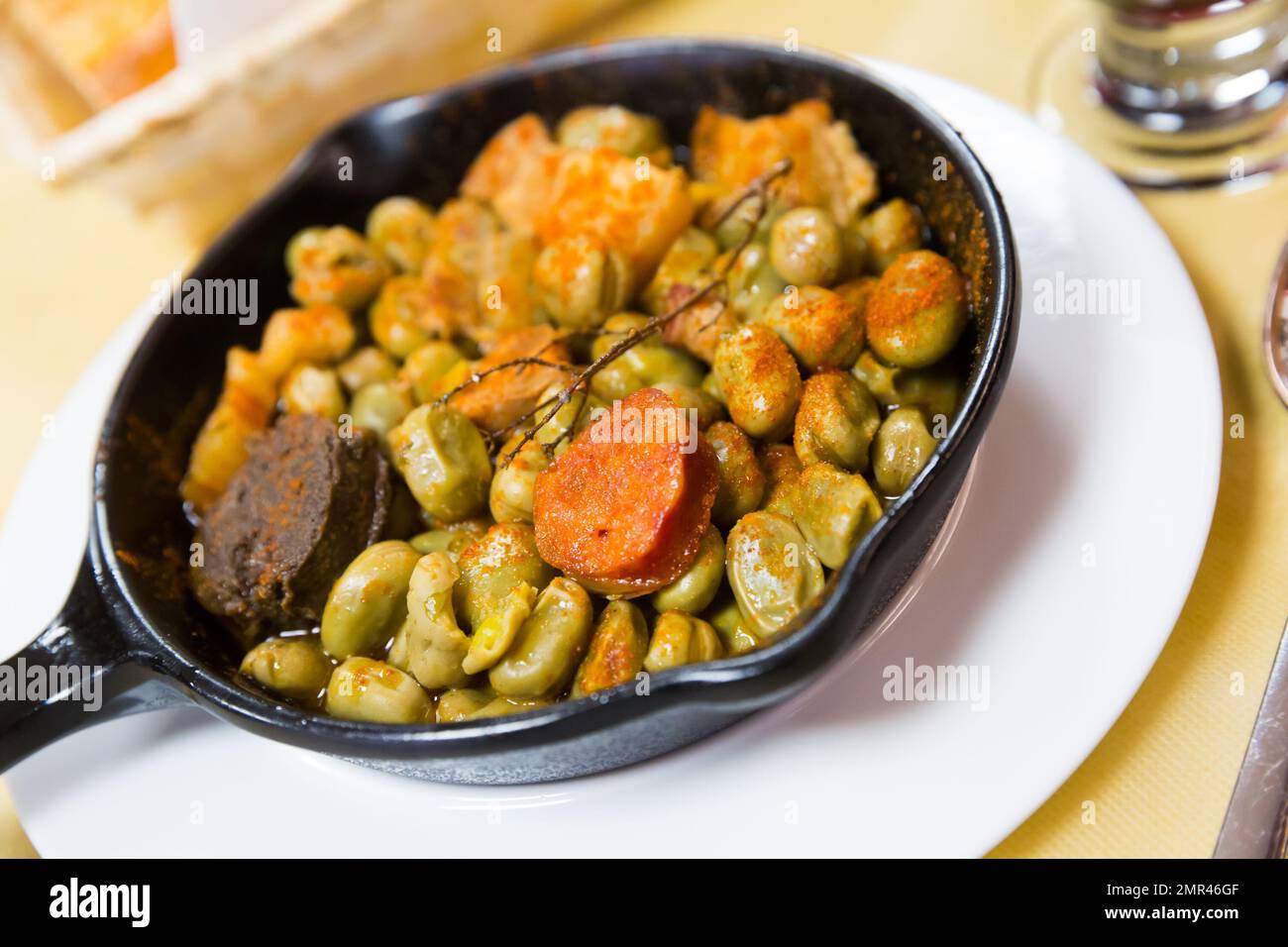 Catalan beans with blood sausage, chorizo, bacon Stock Photo - Alamy