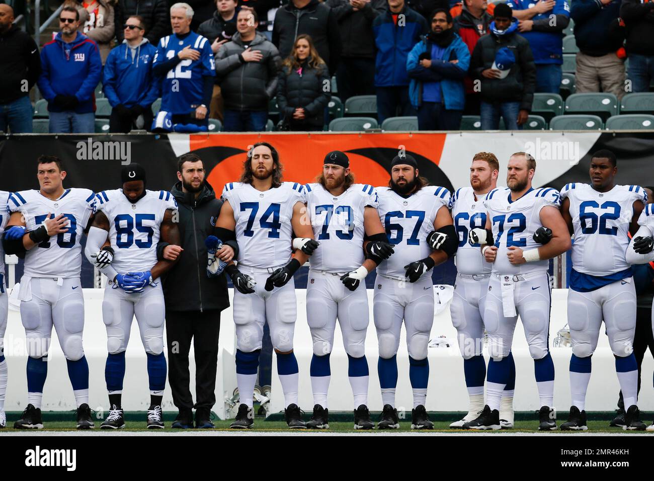 Indianapolis Colts players lock arms as the national anthem is played ...
