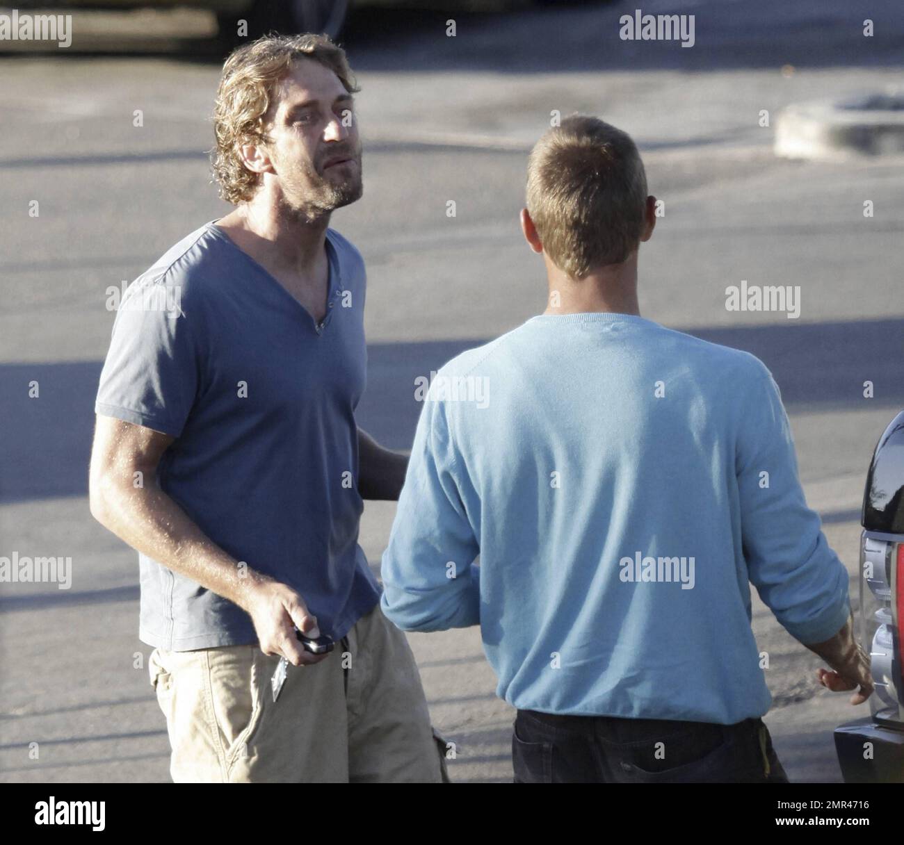Gerard Butler is all smiles and funny faces as he heads to Starbucks ...