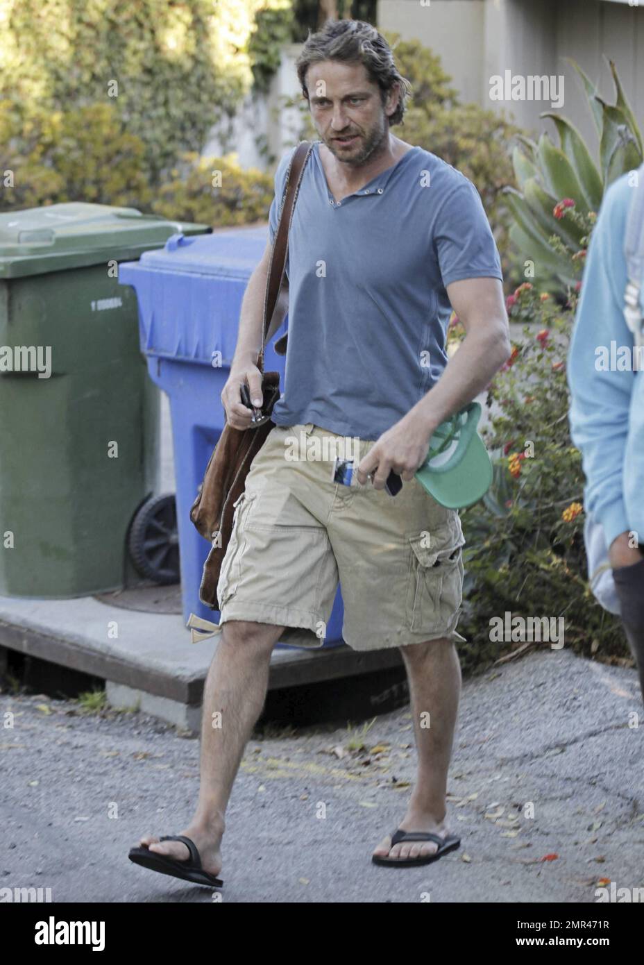Gerard Butler is all smiles and funny faces as he heads to Starbucks ...