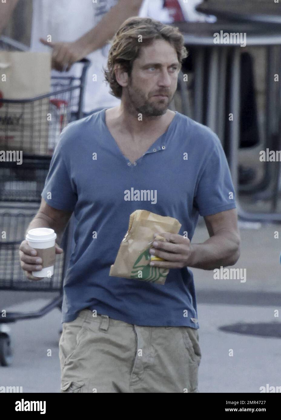 Gerard Butler is all smiles and funny faces as he heads to Starbucks ...