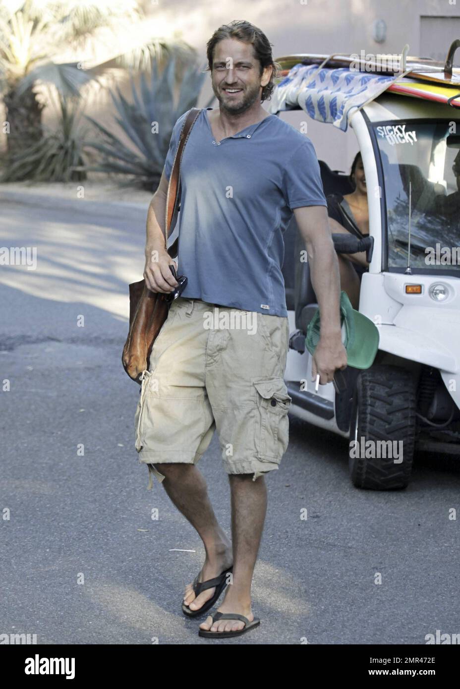 Gerard Butler is all smiles and funny faces as he heads to Starbucks ...