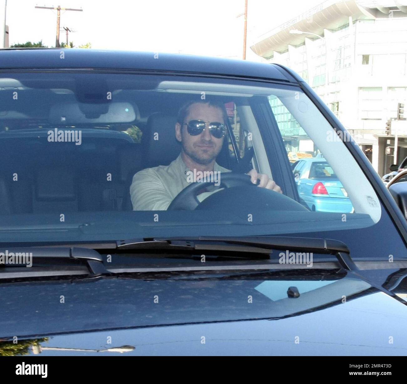 Gerard Butler was spotted out and about driving his Range Rover ...