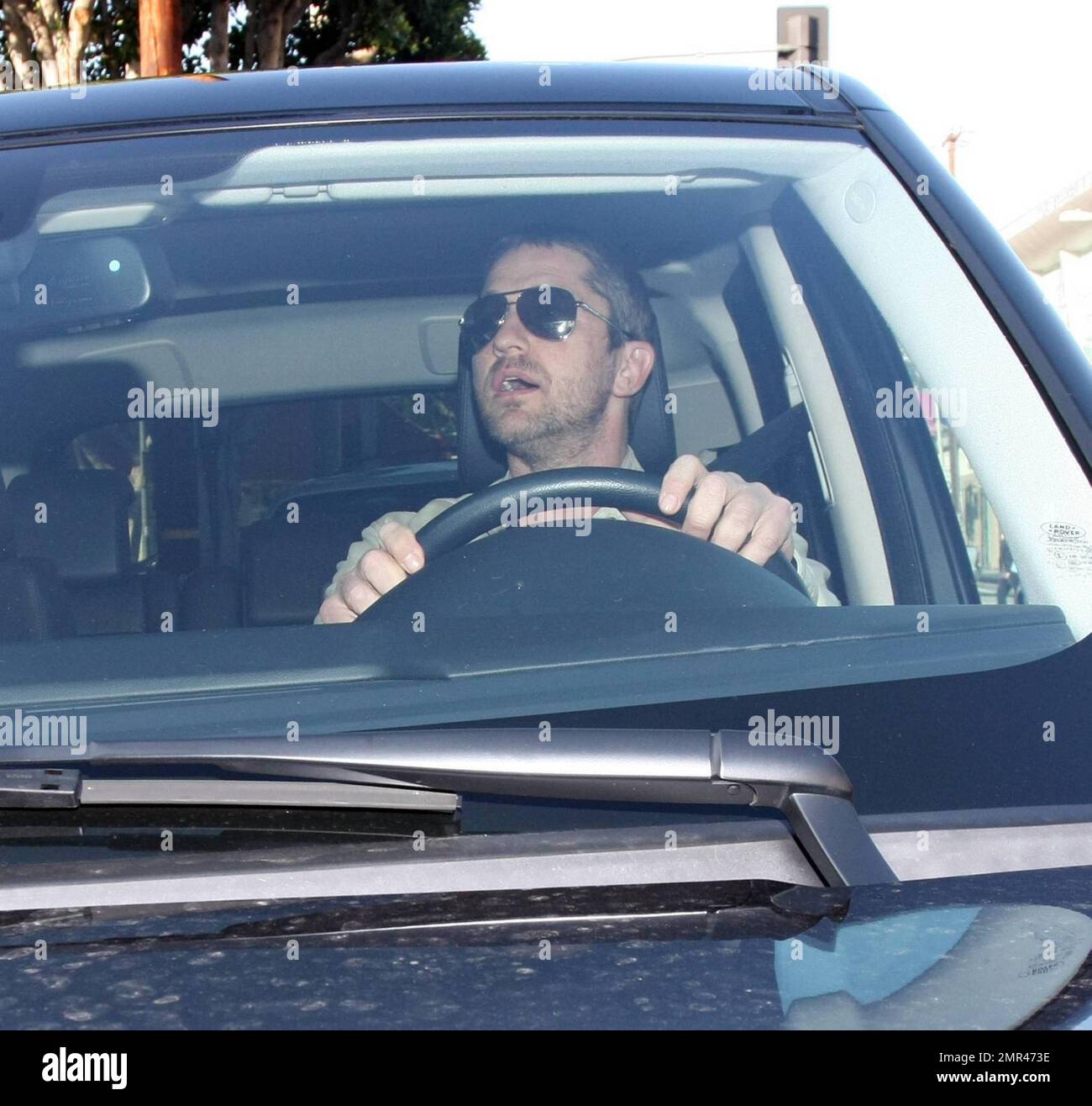 Gerard Butler was spotted out and about driving his Range Rover ...