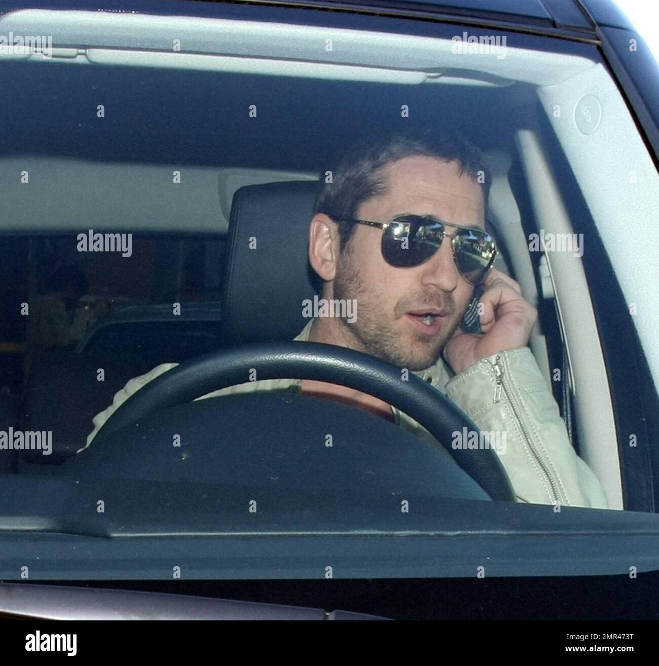 Gerard Butler was spotted out and about driving his Range Rover ...