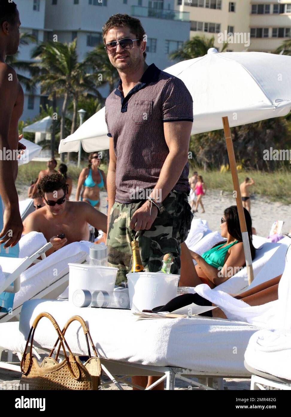 Actor Gerard Butler enjoys a day relaxing on the beach in Miami's South ...