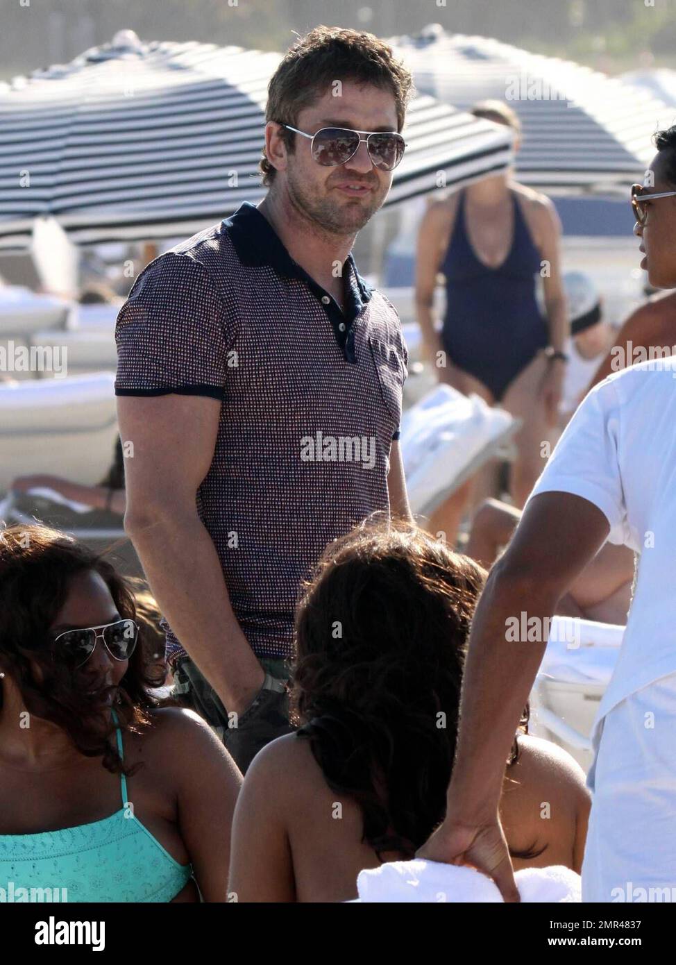 Actor Gerard Butler enjoys a day relaxing on the beach in Miami's South ...