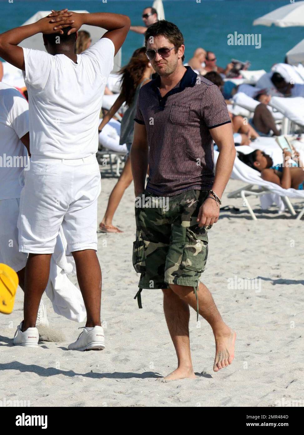 Actor Gerard Butler enjoys a day relaxing on the beach in Miami's South ...
