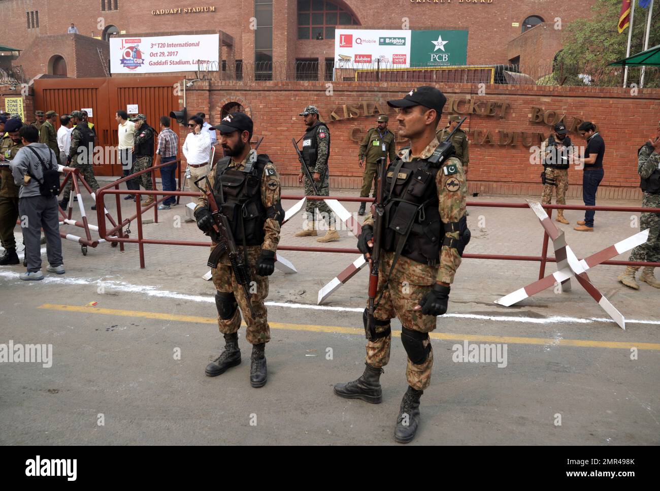 Pakistani troops stand guard at the main gate of Gaddafi Stadium ahead ...