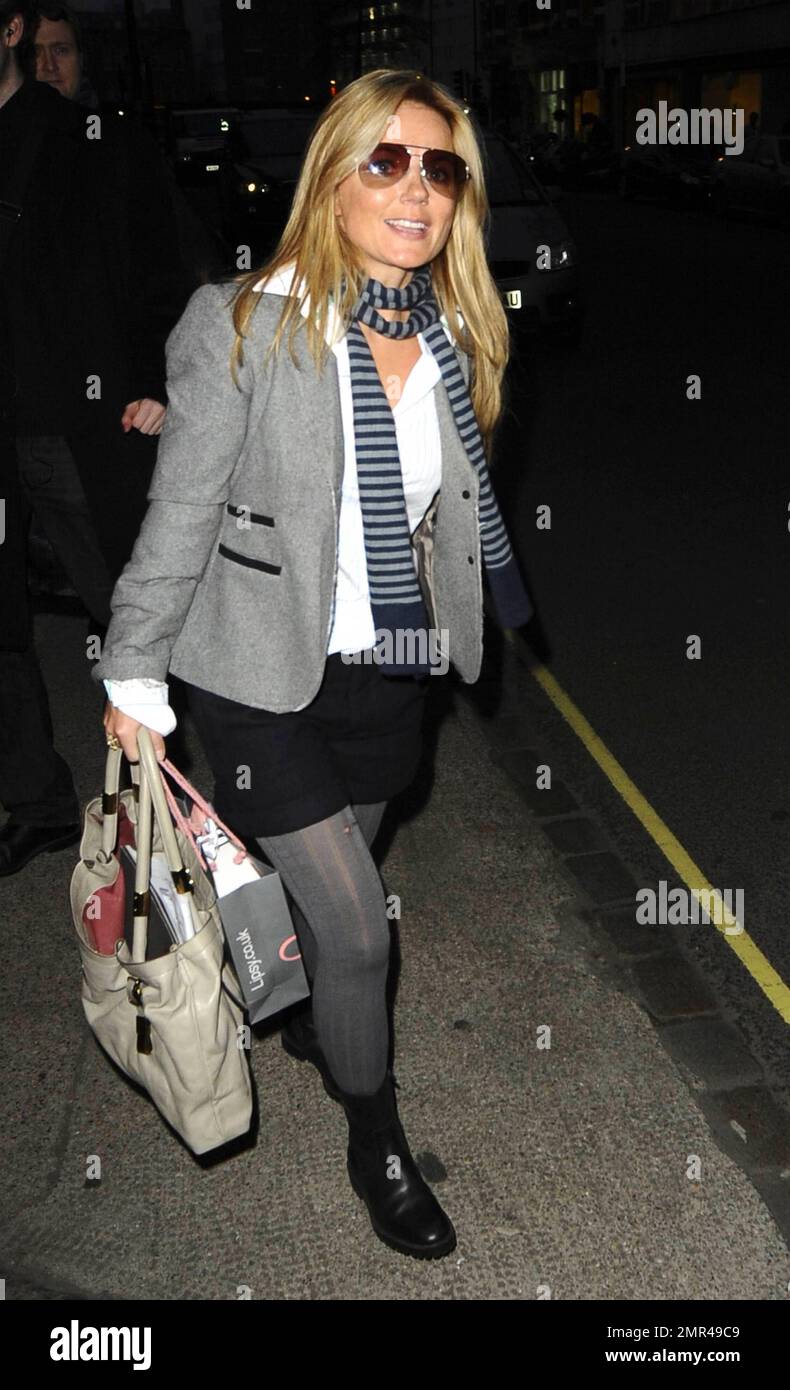 Former Spice Girl Geri Halliwell sports a hole in one of her stockings ...