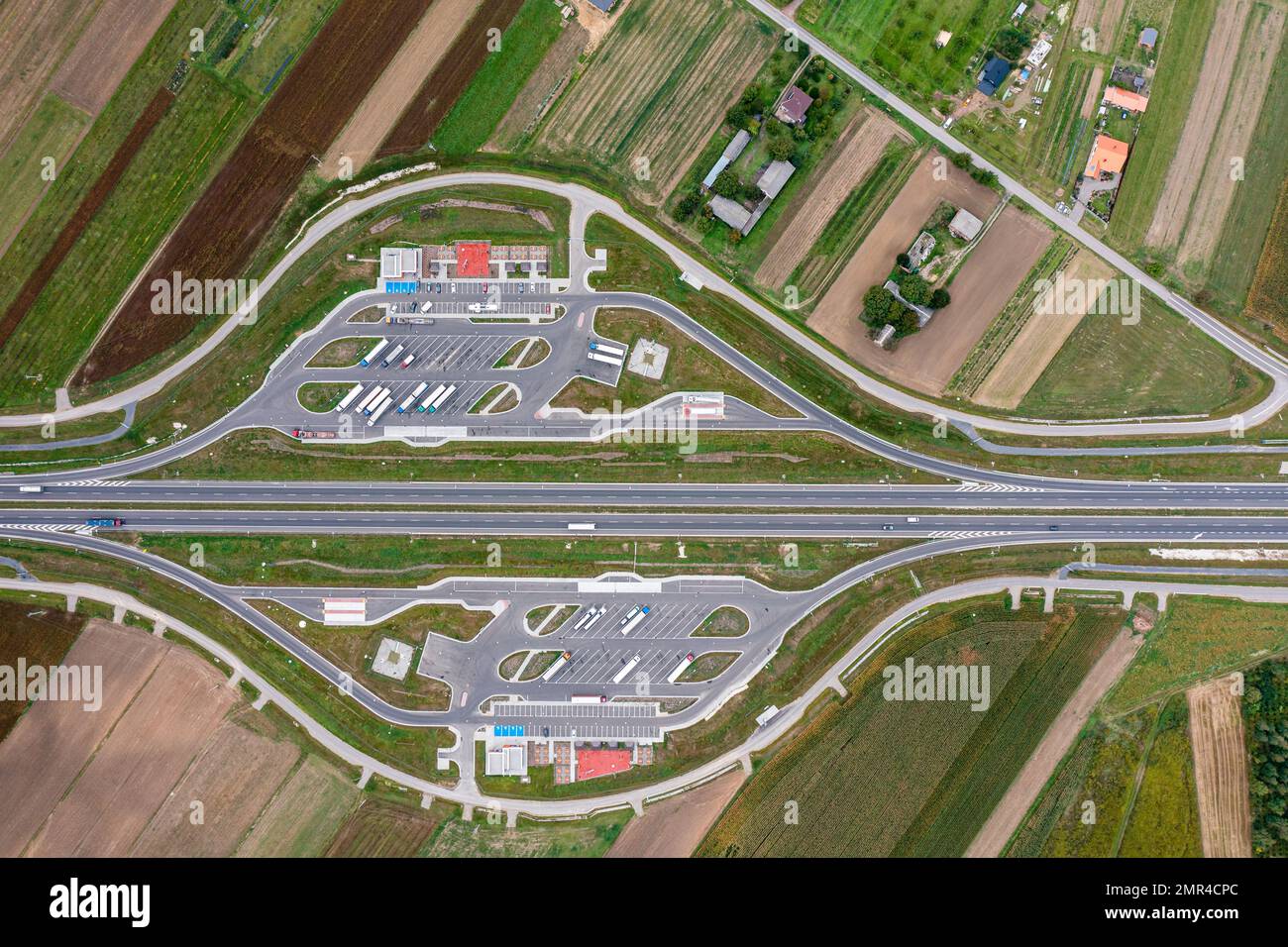 Diminishing aerial perspective of rest area on highway, top down ...