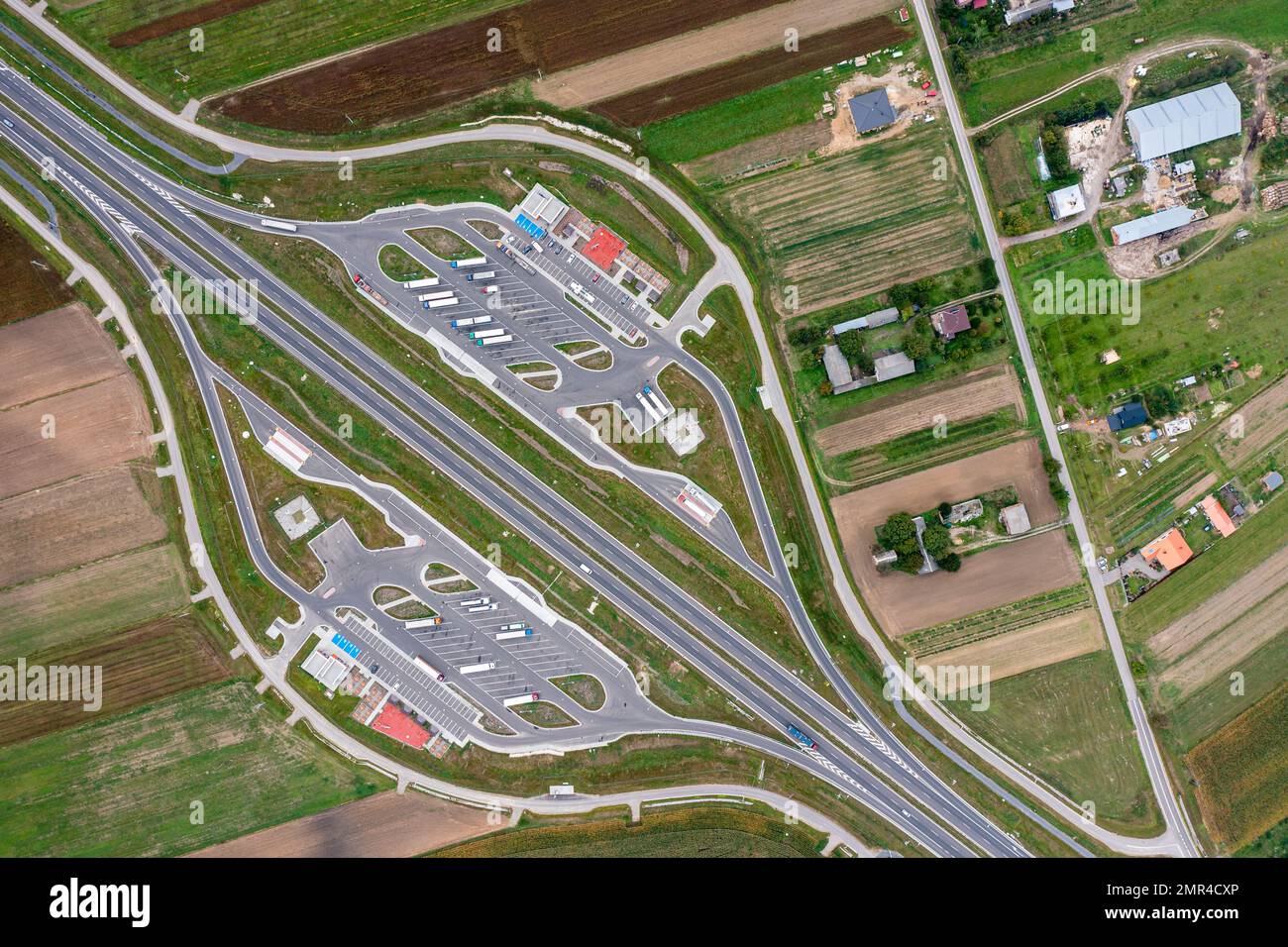 Diminishing aerial perspective of rest area on highway, top down ...