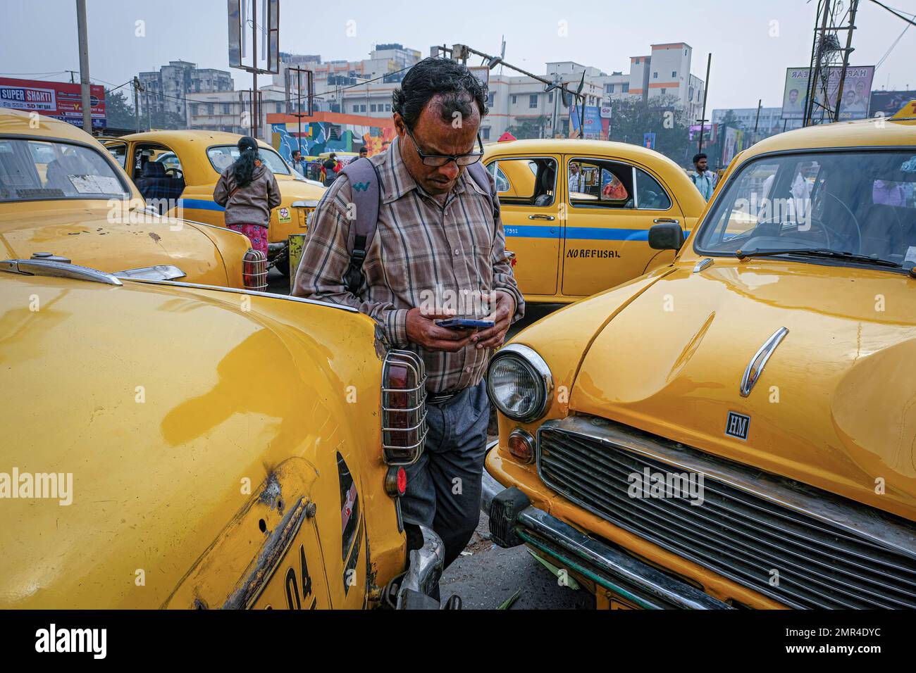 The heritage yellow taxis queue in front of the Sealdah railway station ...