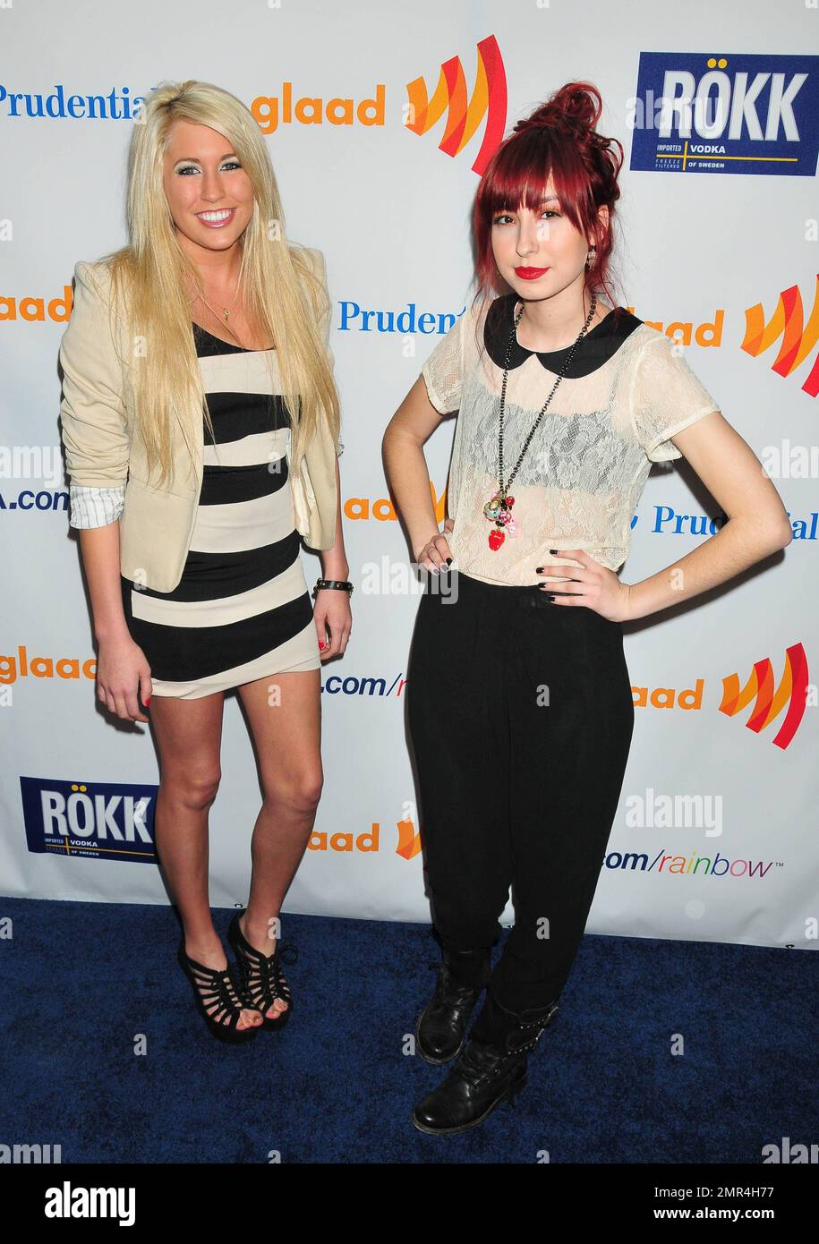 Liz Lee (R) and guest pose for photographers at the 22nd Annual GLAAD ...