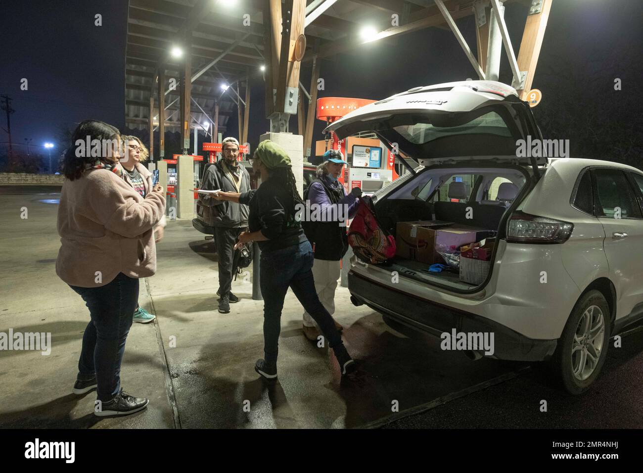 Volunteers participating in an overnight count of homeless people check ...