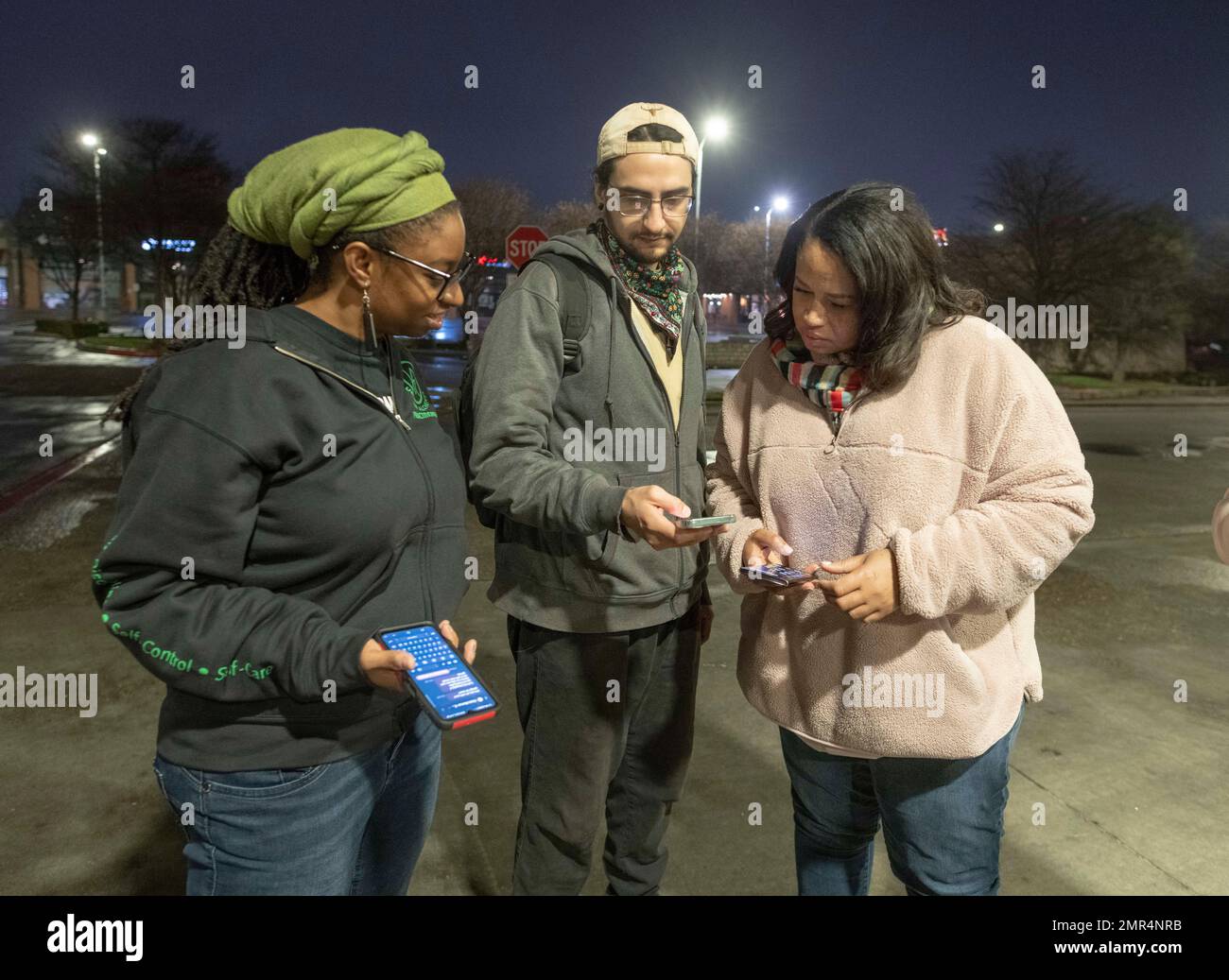 Volunteers participating in an overnight count of homeless people check ...