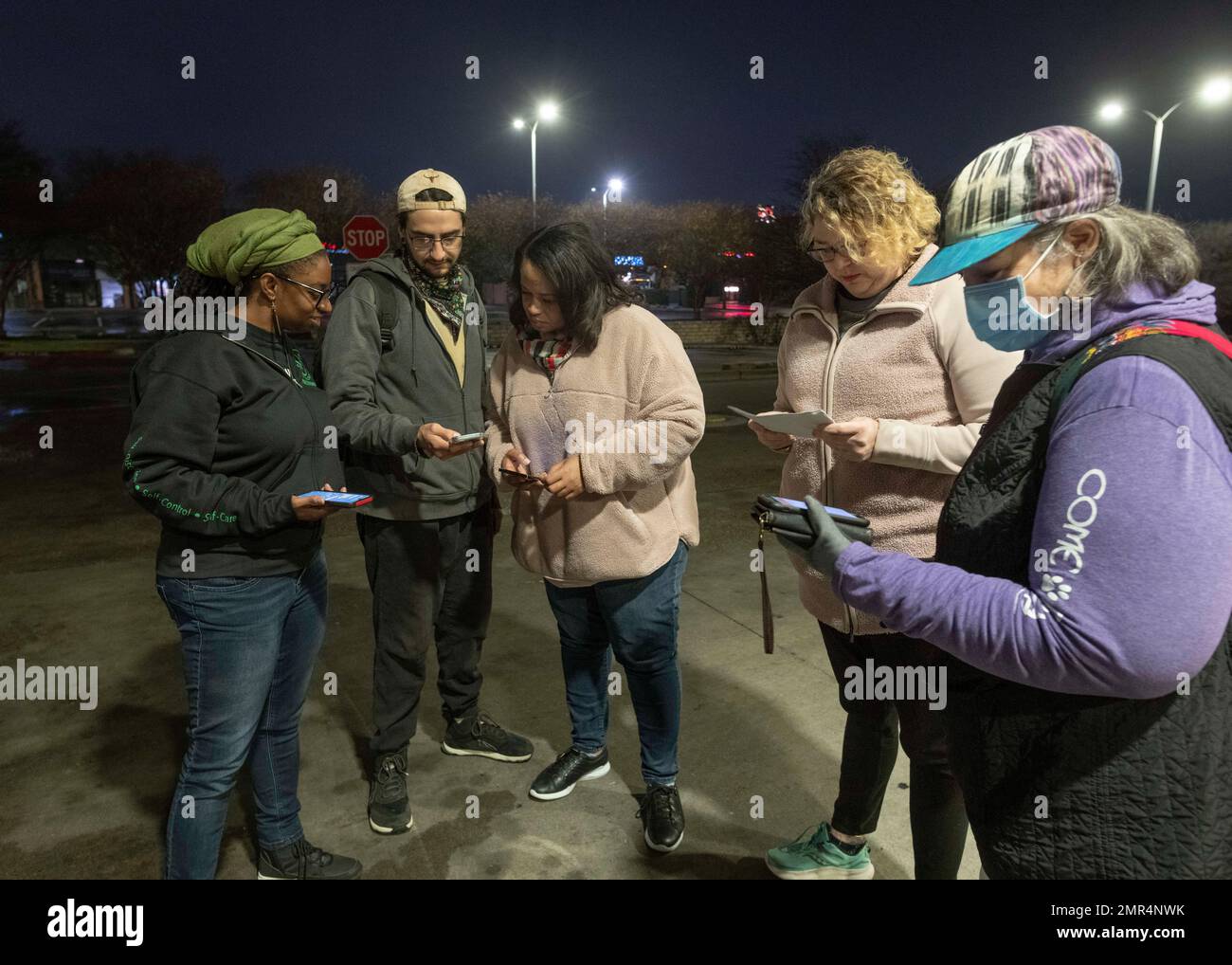 Volunteers participating in an overnight count of homeless people check ...