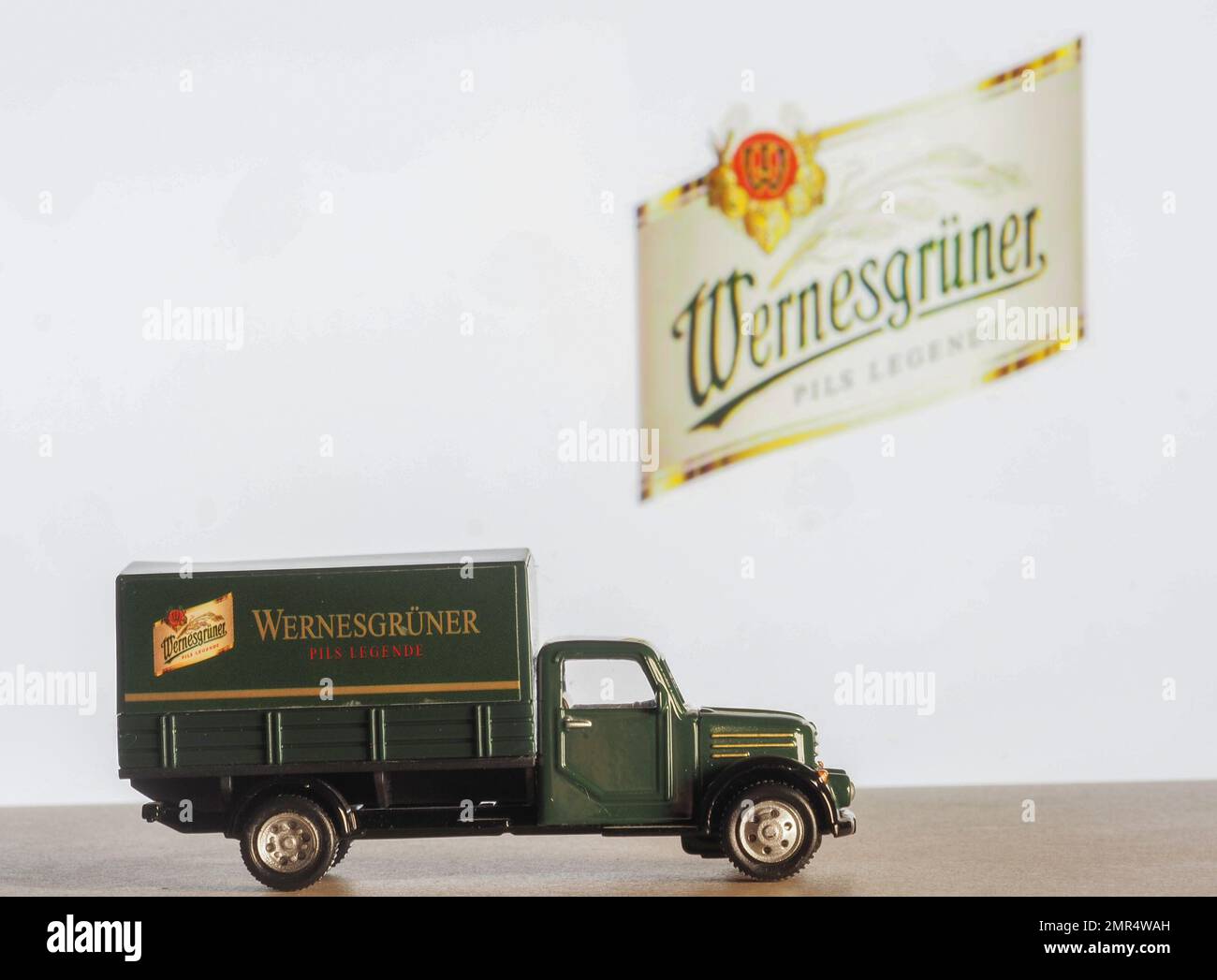 In this photo illustration, a model of a truck with an inscription ...