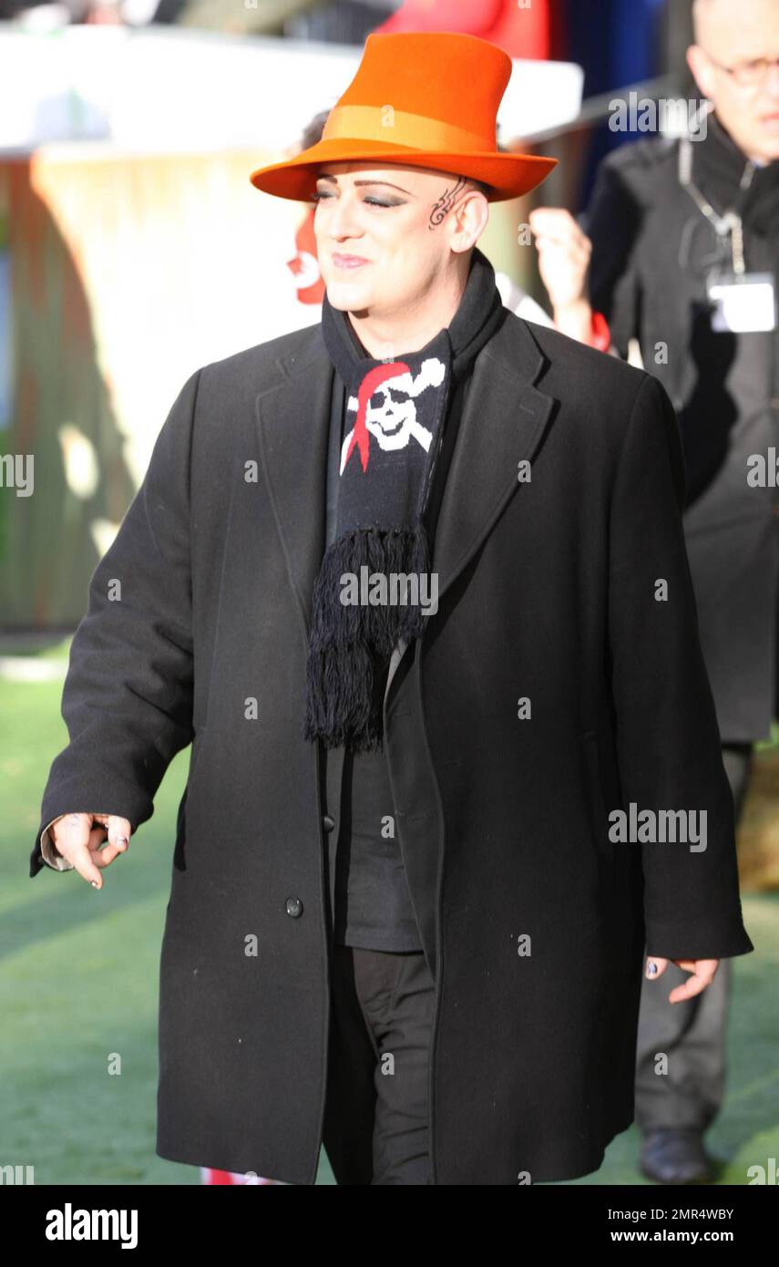 Boy George (aka George O'Dowd) wears an orange hat on the green carpet ...