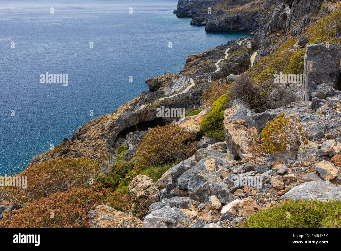 beautiful rocky seashore with a path along the sea Stock Photo - Alamy