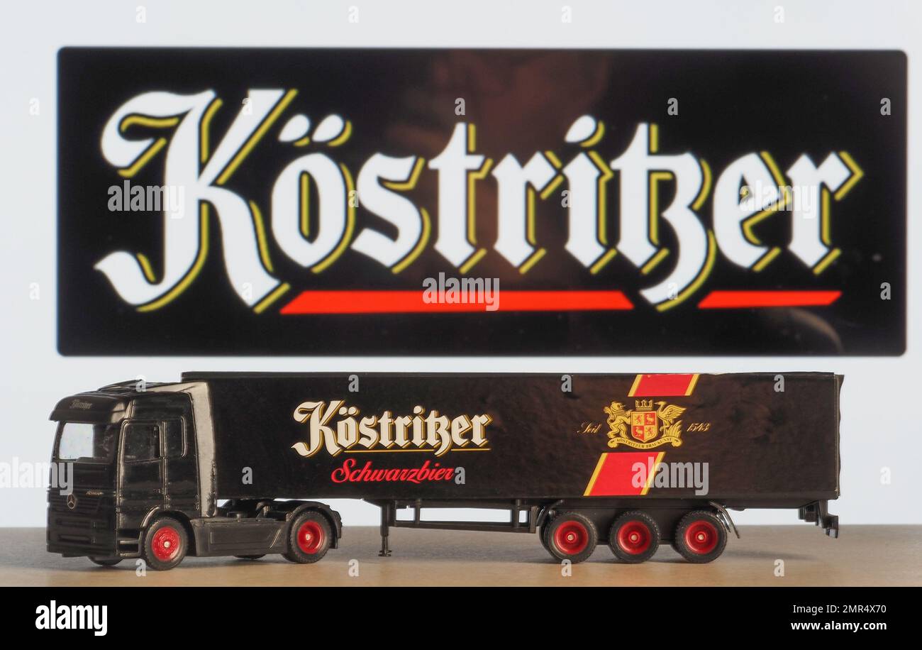 In this photo illustration, a model of a beer truck with an inscription ...