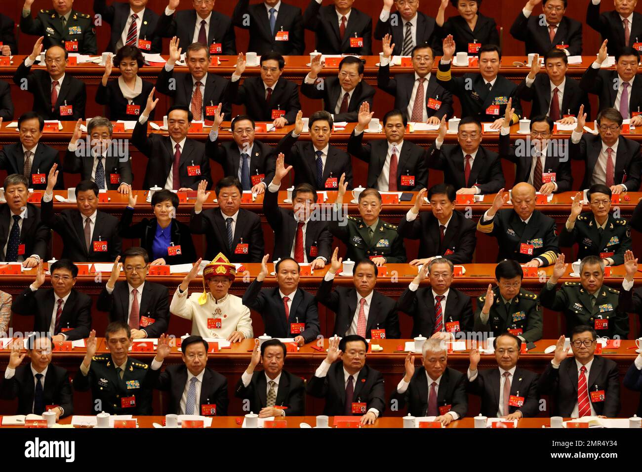 In this Tuesday, Oct. 24, 2017, file photo, delegates raise their hands ...