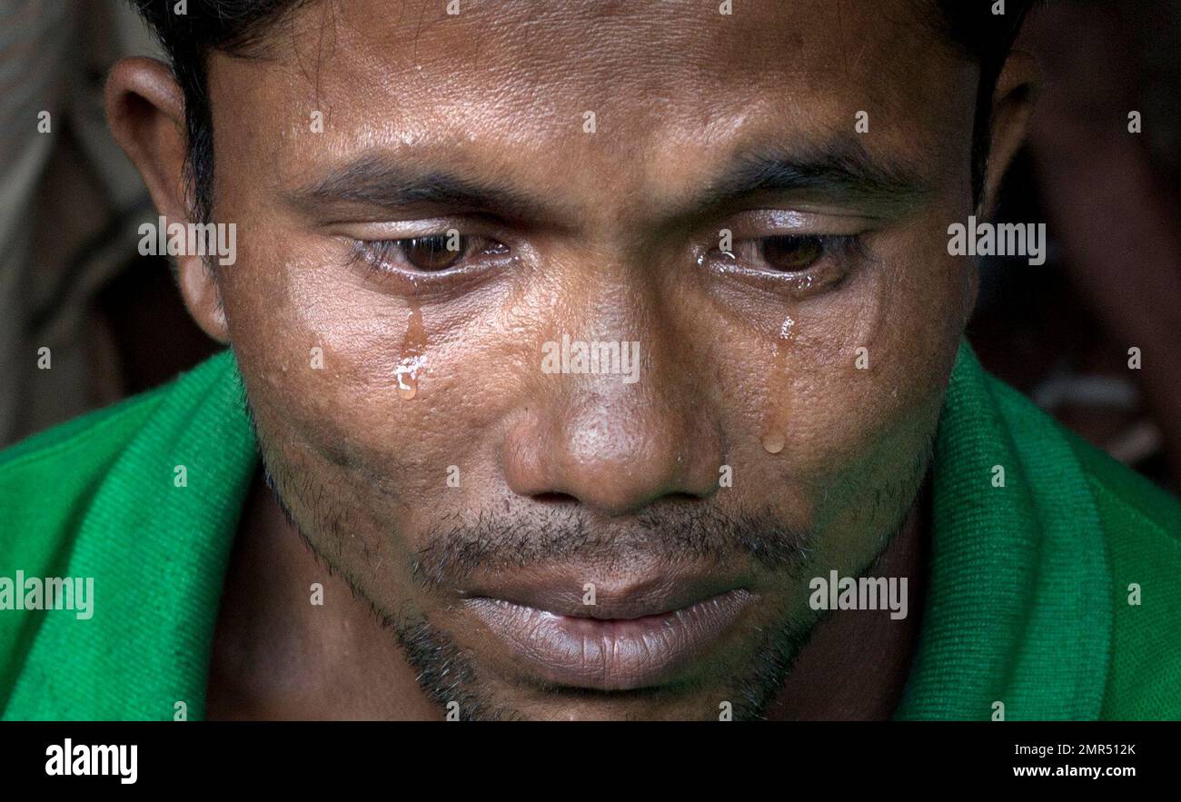 In this Sept. 30, 2017, photo tears roll down the cheeks of Rohingya ...