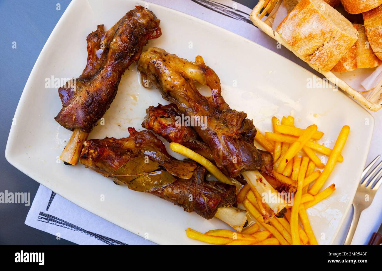 Baked lamb shins Stock Photo - Alamy