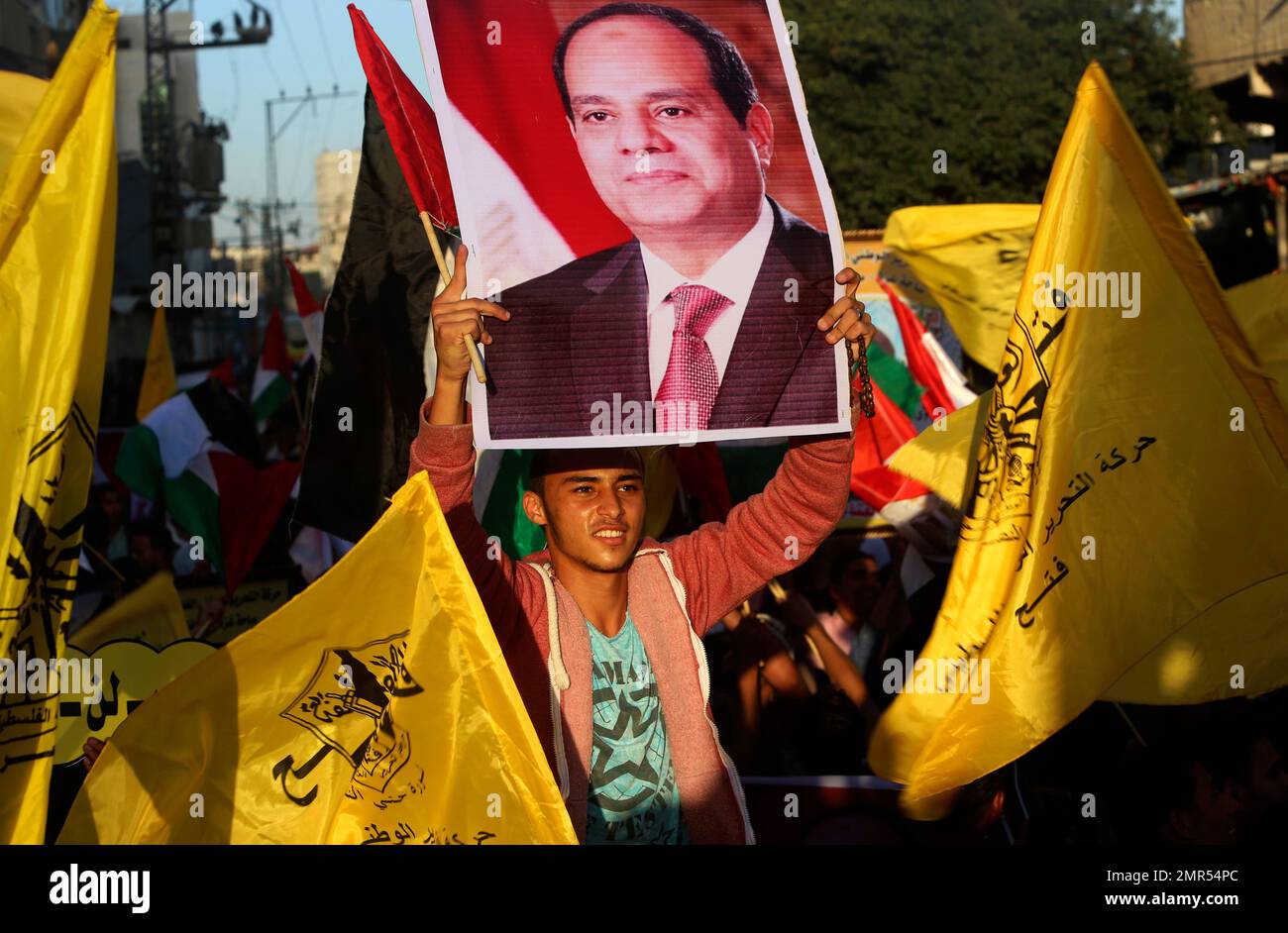 A supporter of exiled former Gaza strongman Mohammed Dahlan, holds ...