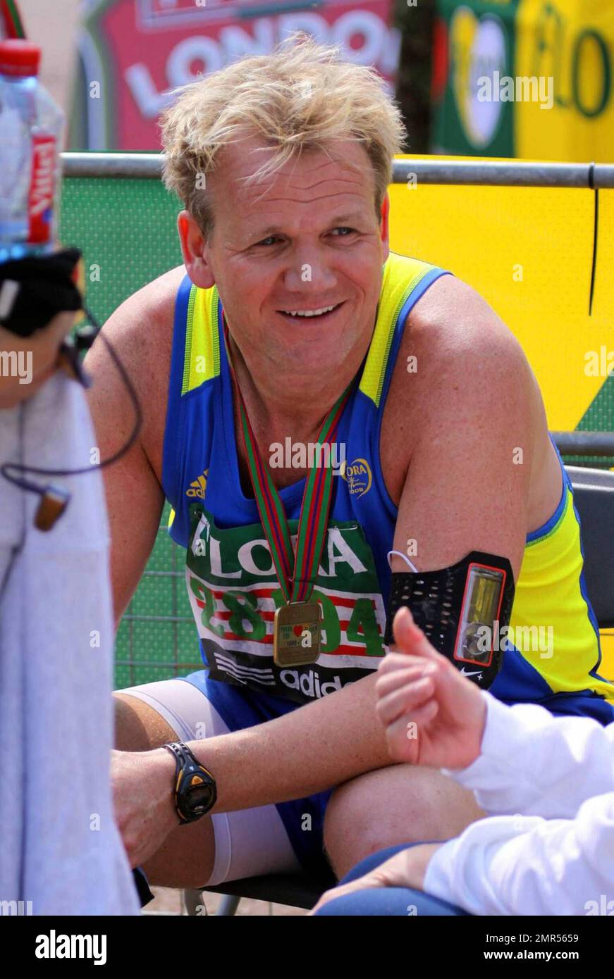 Gordon Ramsay shows off his medal after completing the Flora London ...