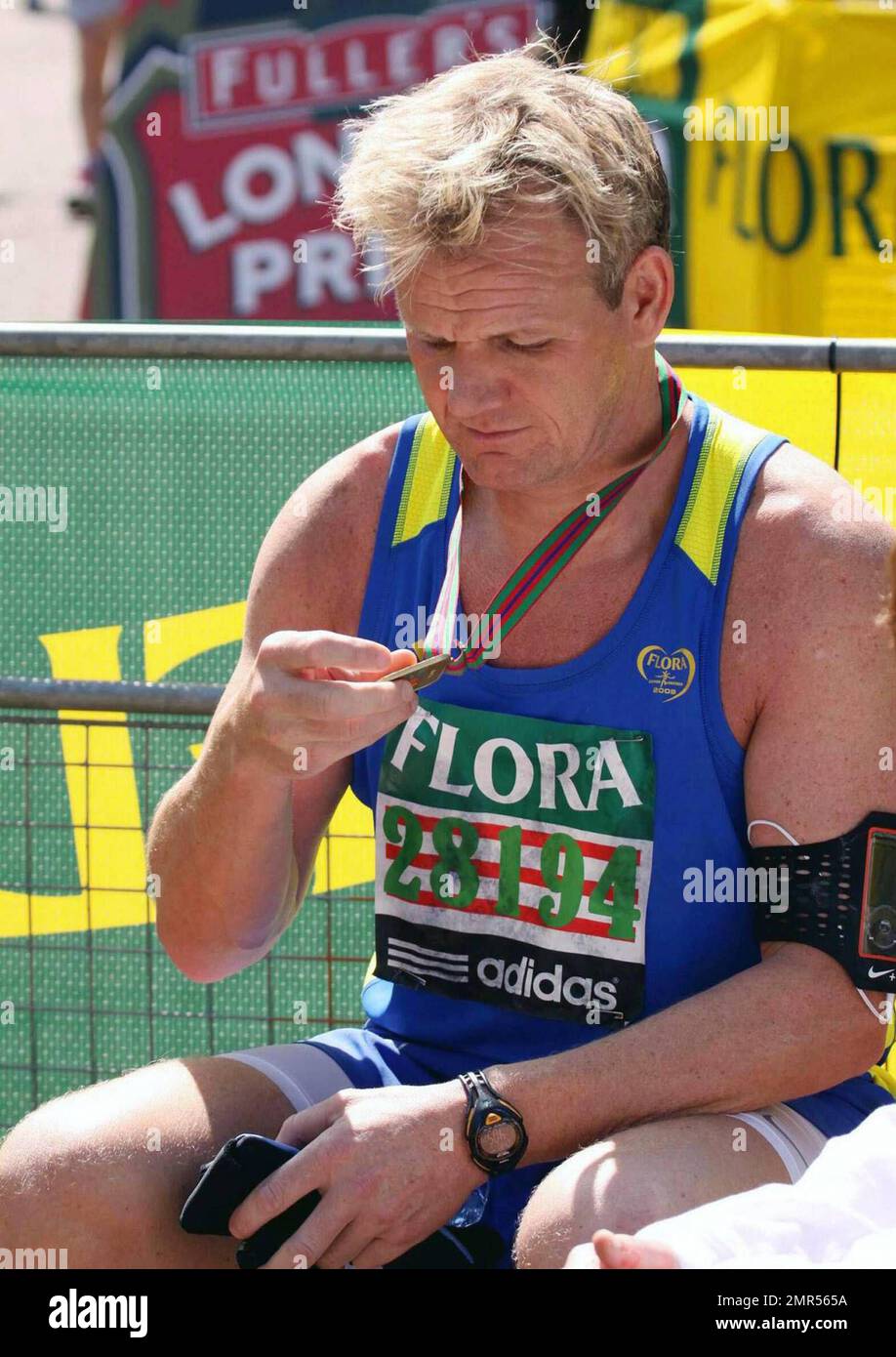 Gordon Ramsay shows off his medal after completing the Flora London ...