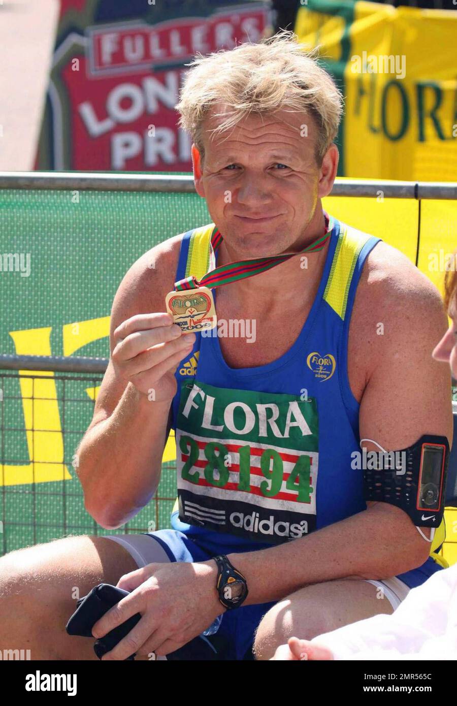 Gordon Ramsay shows off his medal after completing the Flora London ...