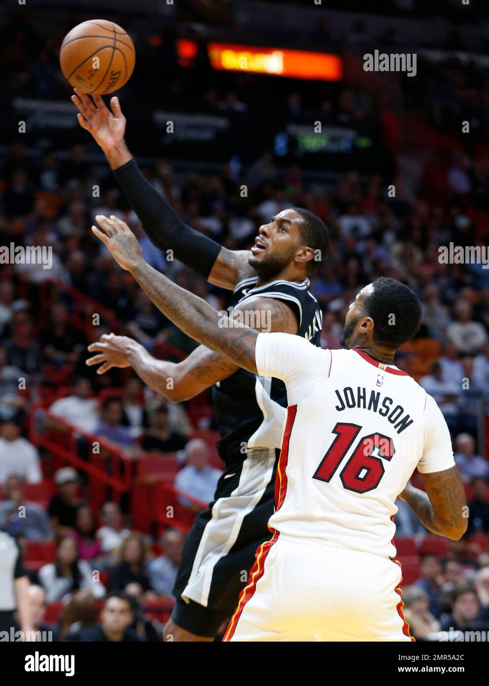San Antonio Spurs forward LaMarcus Aldridge, rear, goes up for a shot ...