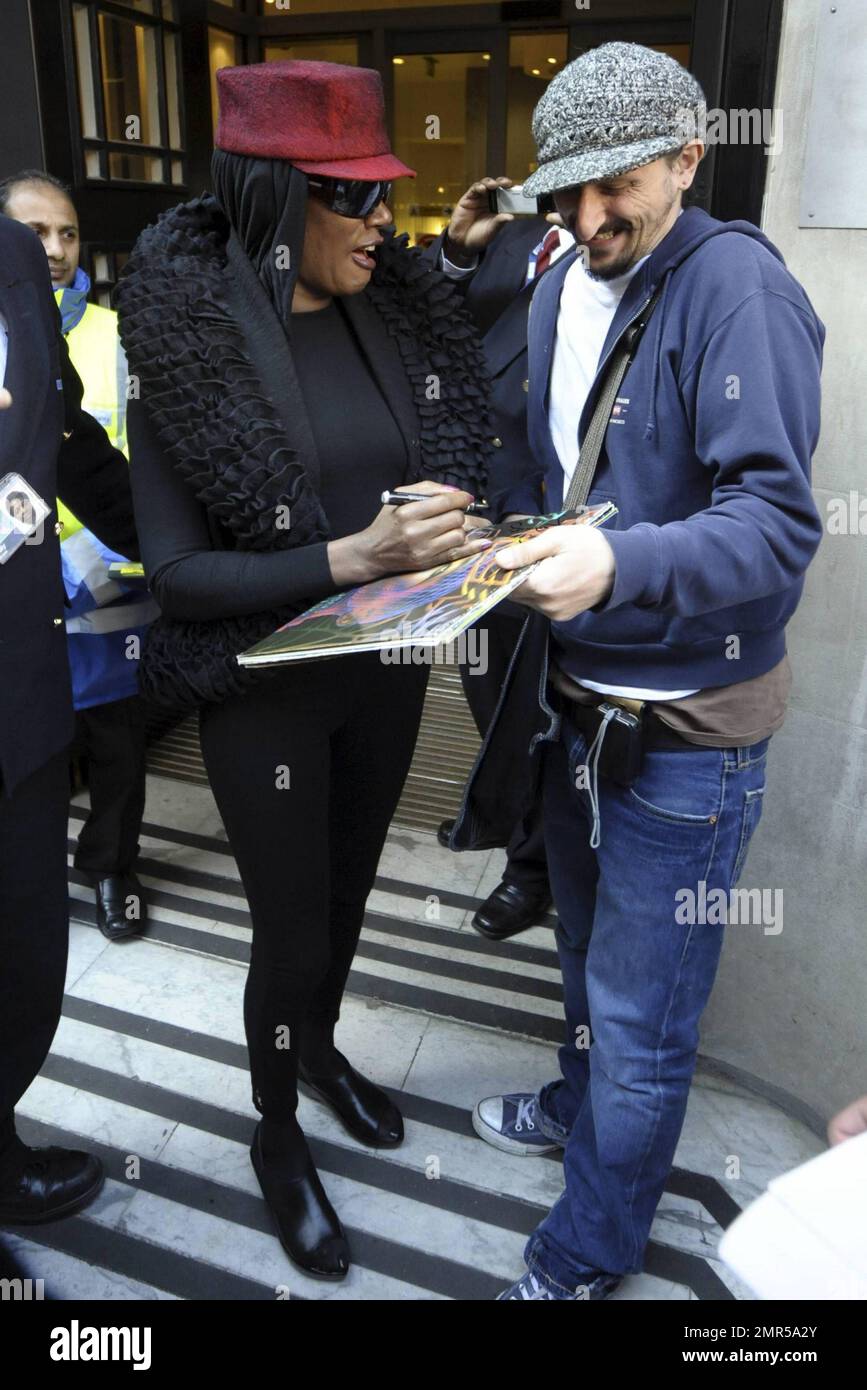 Grace Jones signs autographs for her loyal fans outside the BBC. As ...