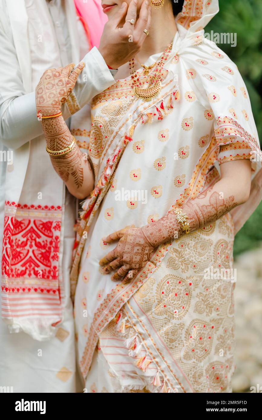 A vertical close-up shot of the groom and bride at an Indian ...