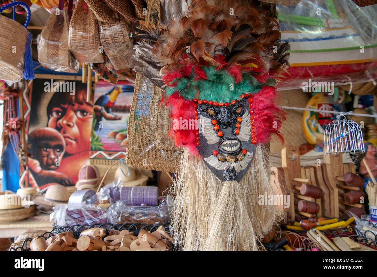 Wooden face mask decorated with fetahers and fish teeth. Location ...
