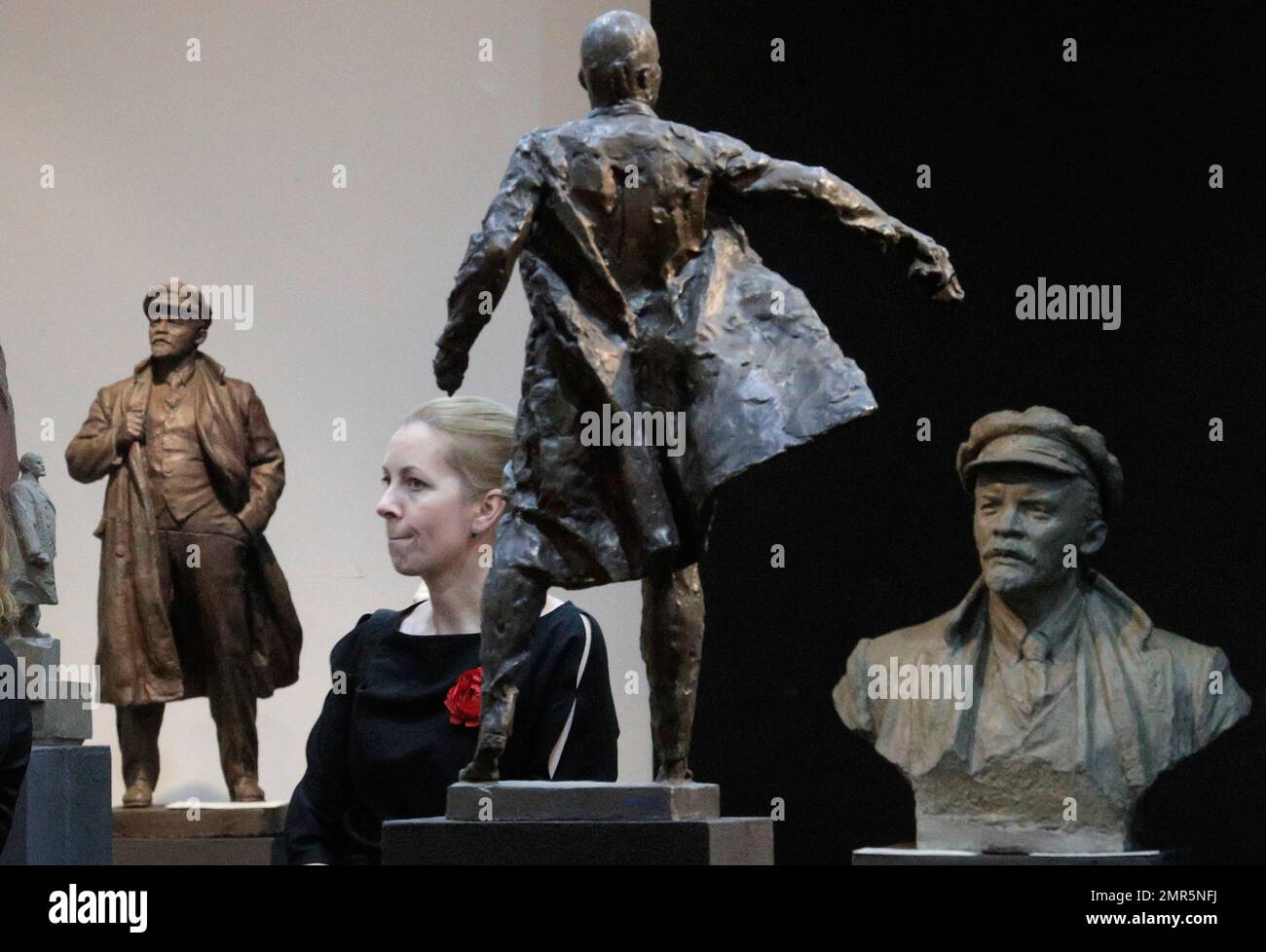 Visitors walk among Vladimir Lenin sculptures at the exhibition 'The ...