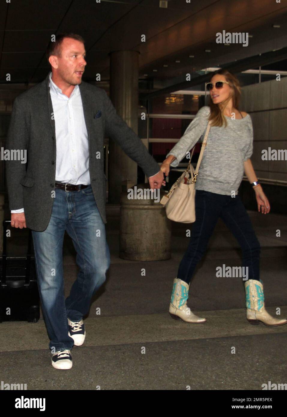 Director Guy Ritchie with his pregnant girlfriend Jacqui Ainsley ...