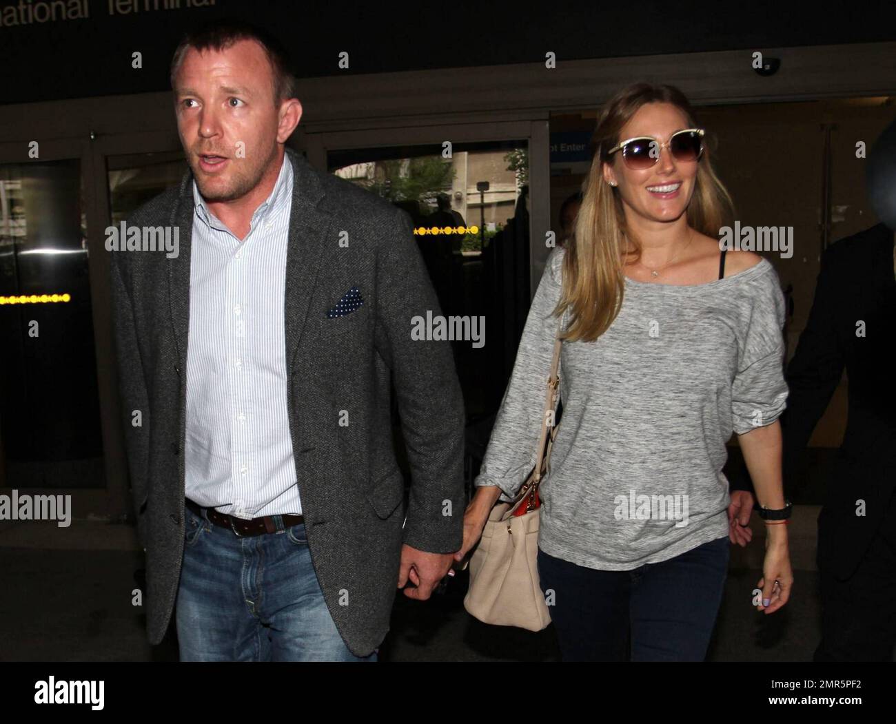 Director Guy Ritchie with his pregnant girlfriend Jacqui Ainsley ...