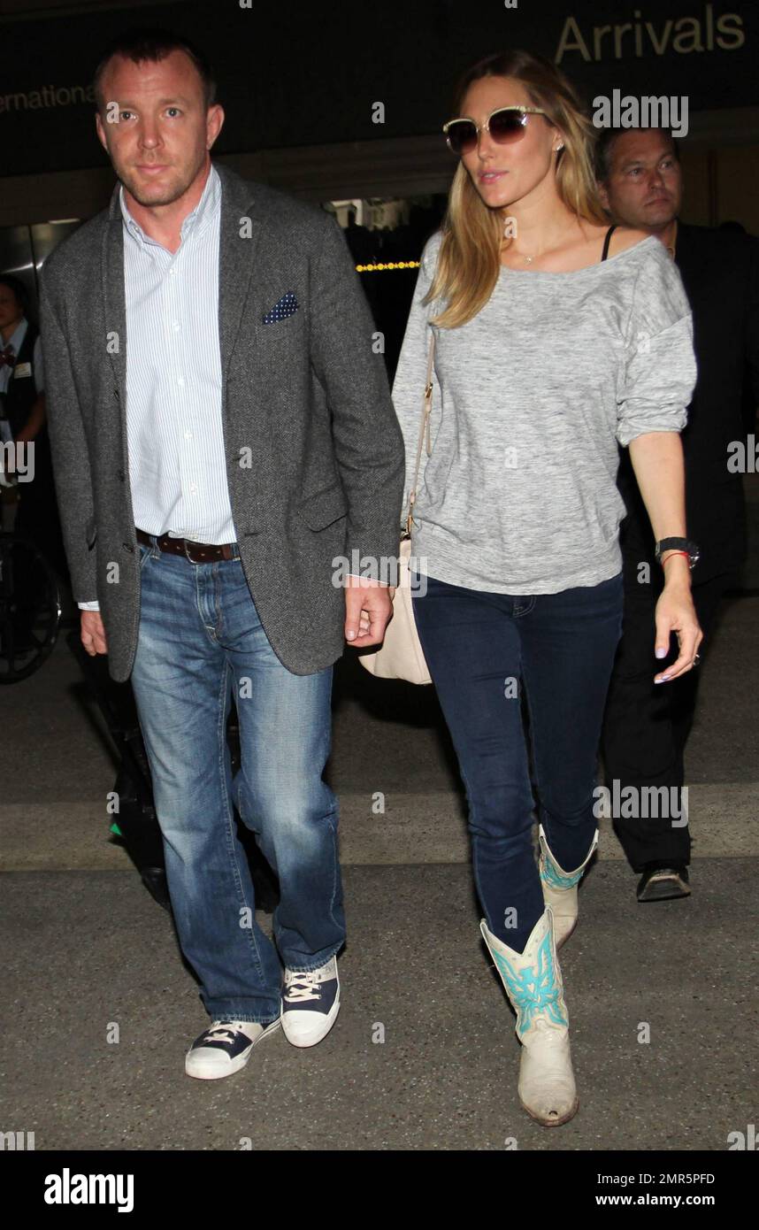 Director Guy Ritchie with his pregnant girlfriend Jacqui Ainsley ...