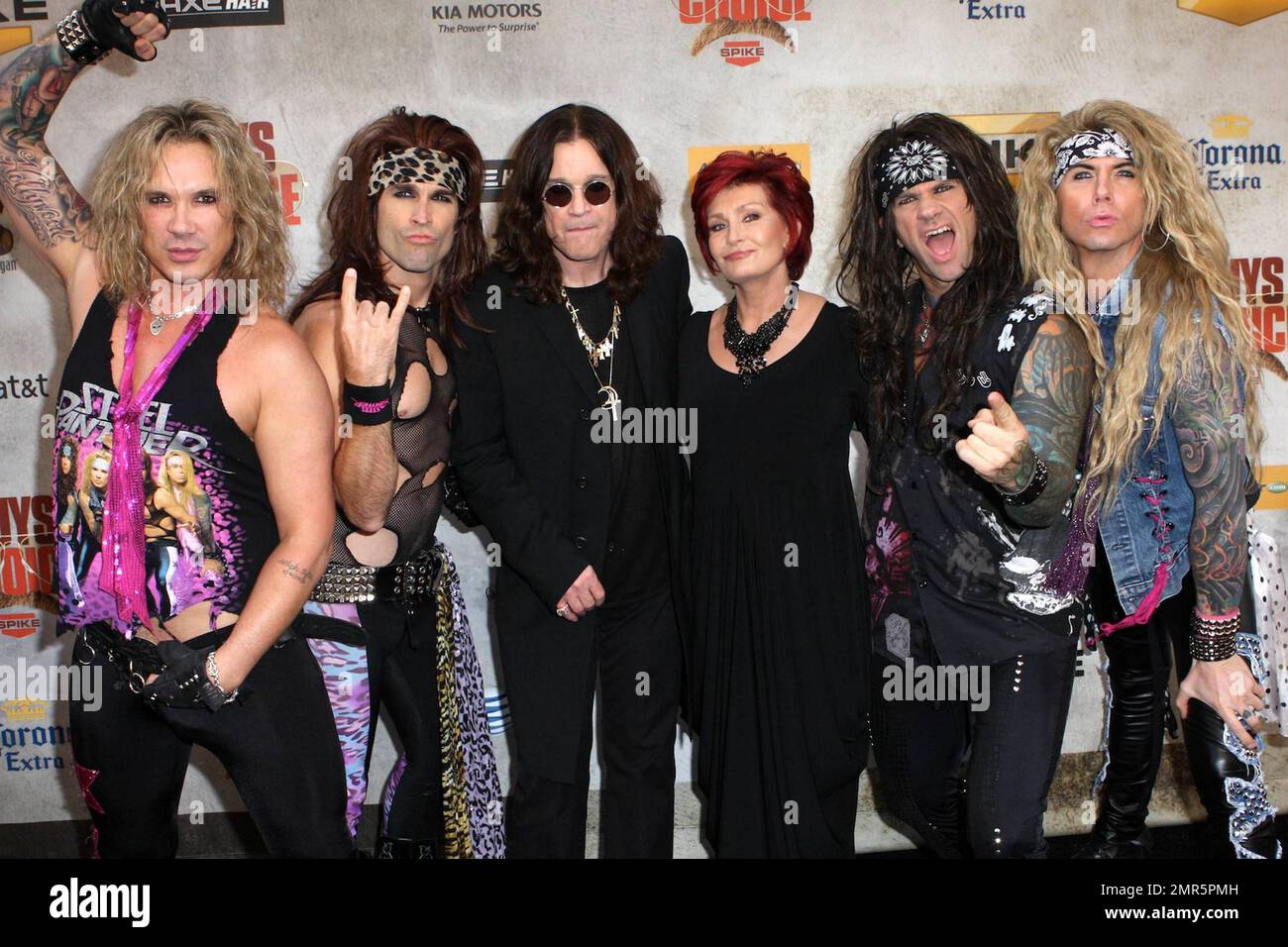 Ozzy Osbourne and Sharon Osbourne playful pose with parody glam-metal ...