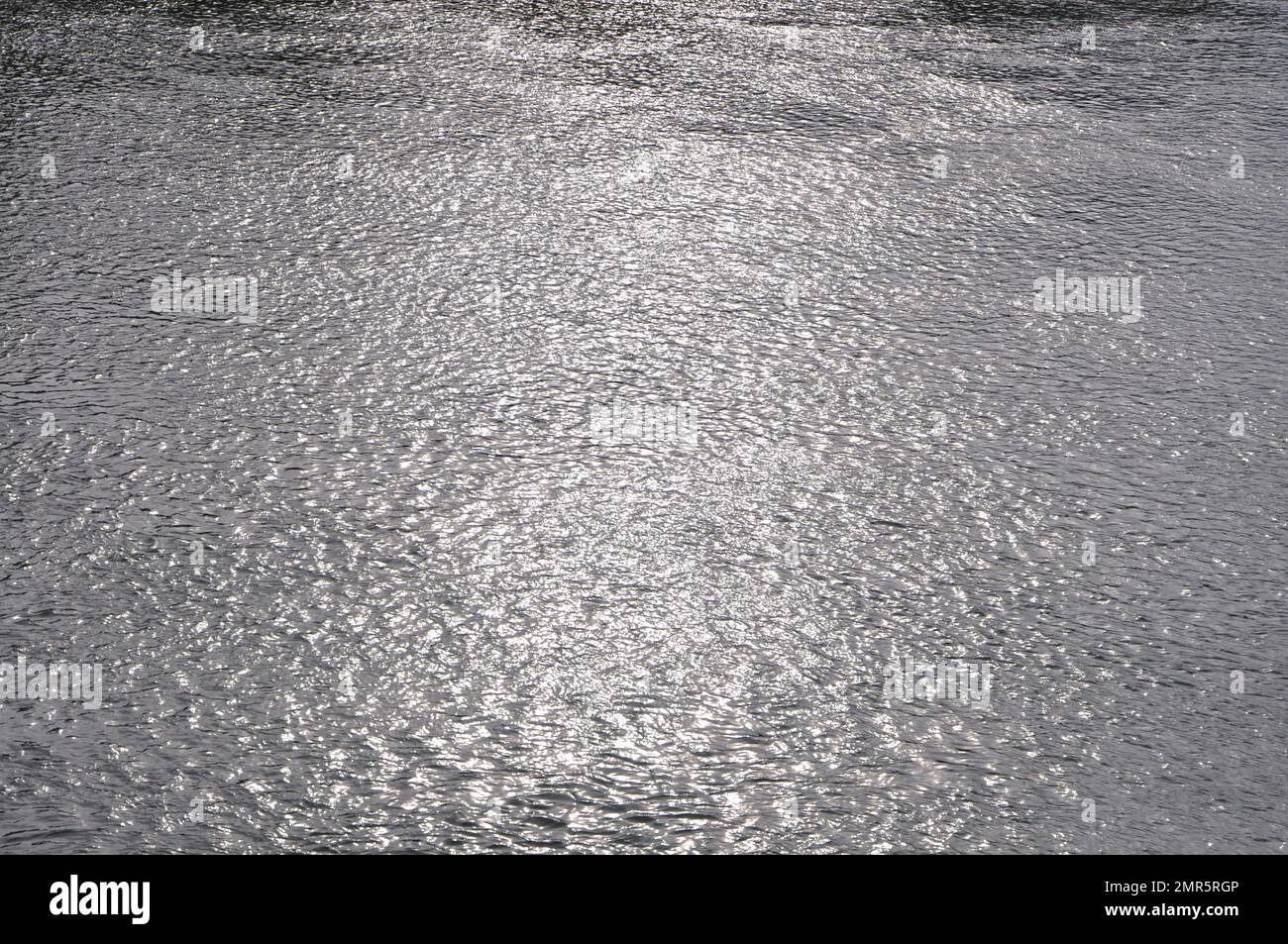 Abstract metallic color of water surface.Sea surface covered with tiny ...