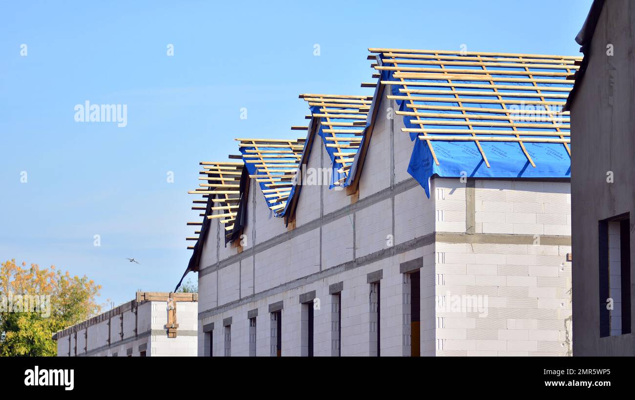 Terraced houses under construction. Housing estate development under ...