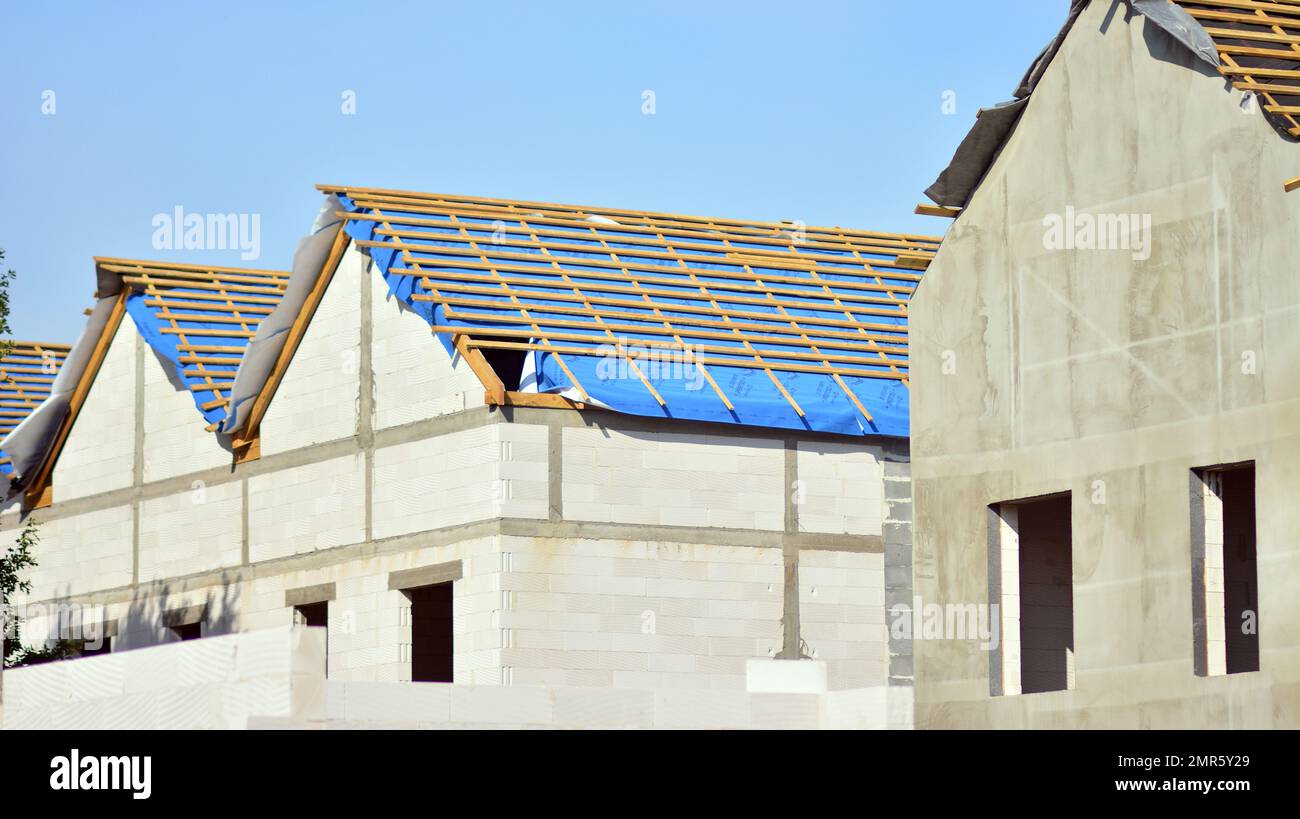 Terraced houses under construction. Housing estate development under ...