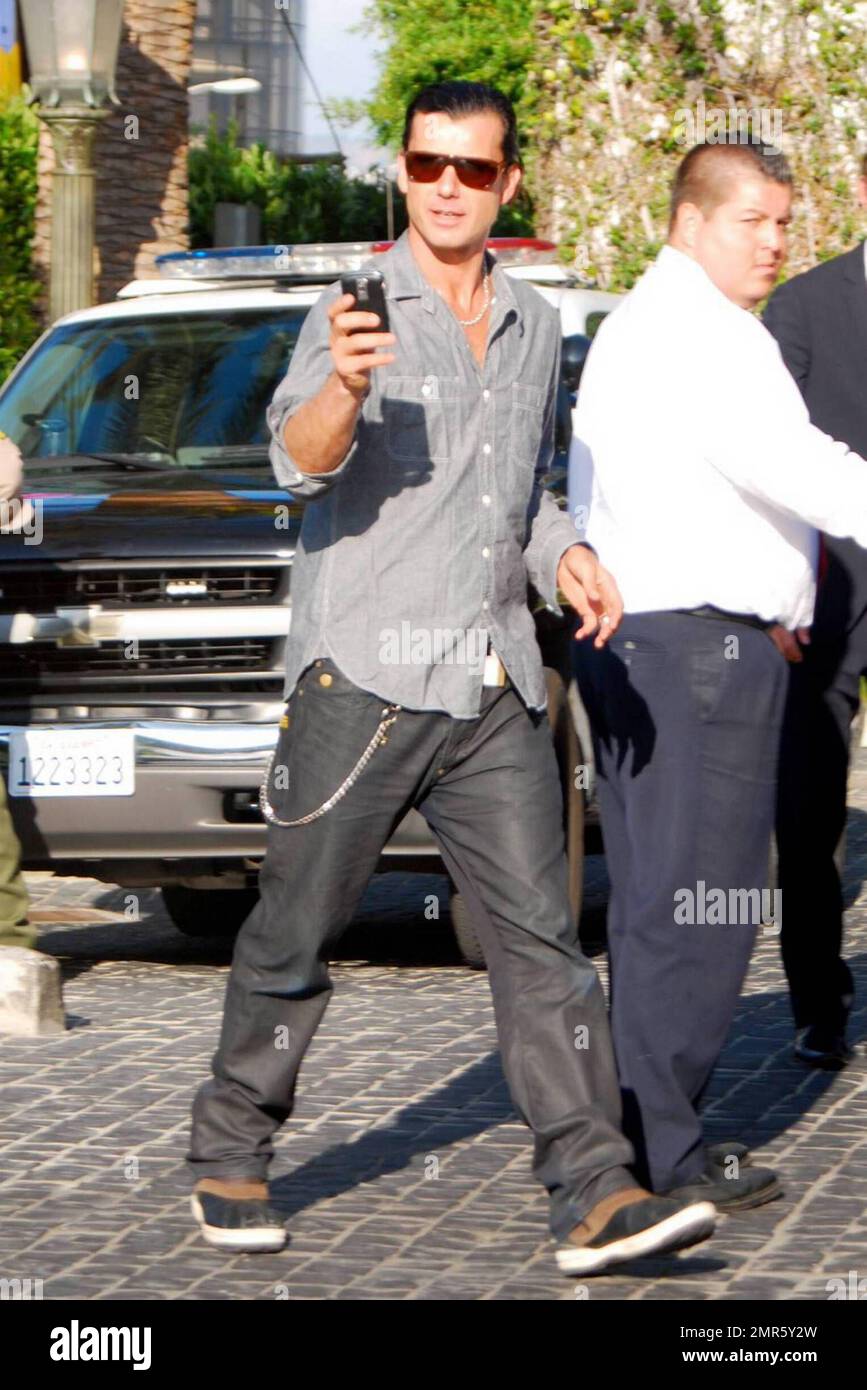 Gavin Rossdale takes some photos with his cellphone camera after making ...