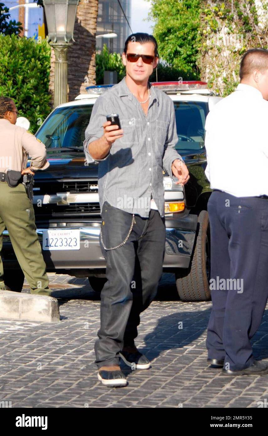 Gavin Rossdale takes some photos with his cellphone camera after making ...