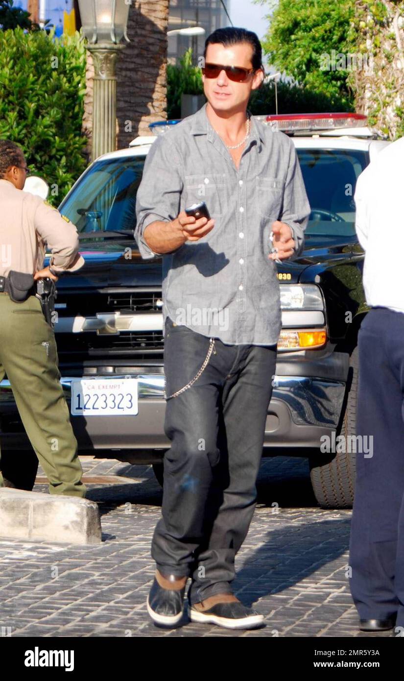 Gavin Rossdale takes some photos with his cellphone camera after making ...